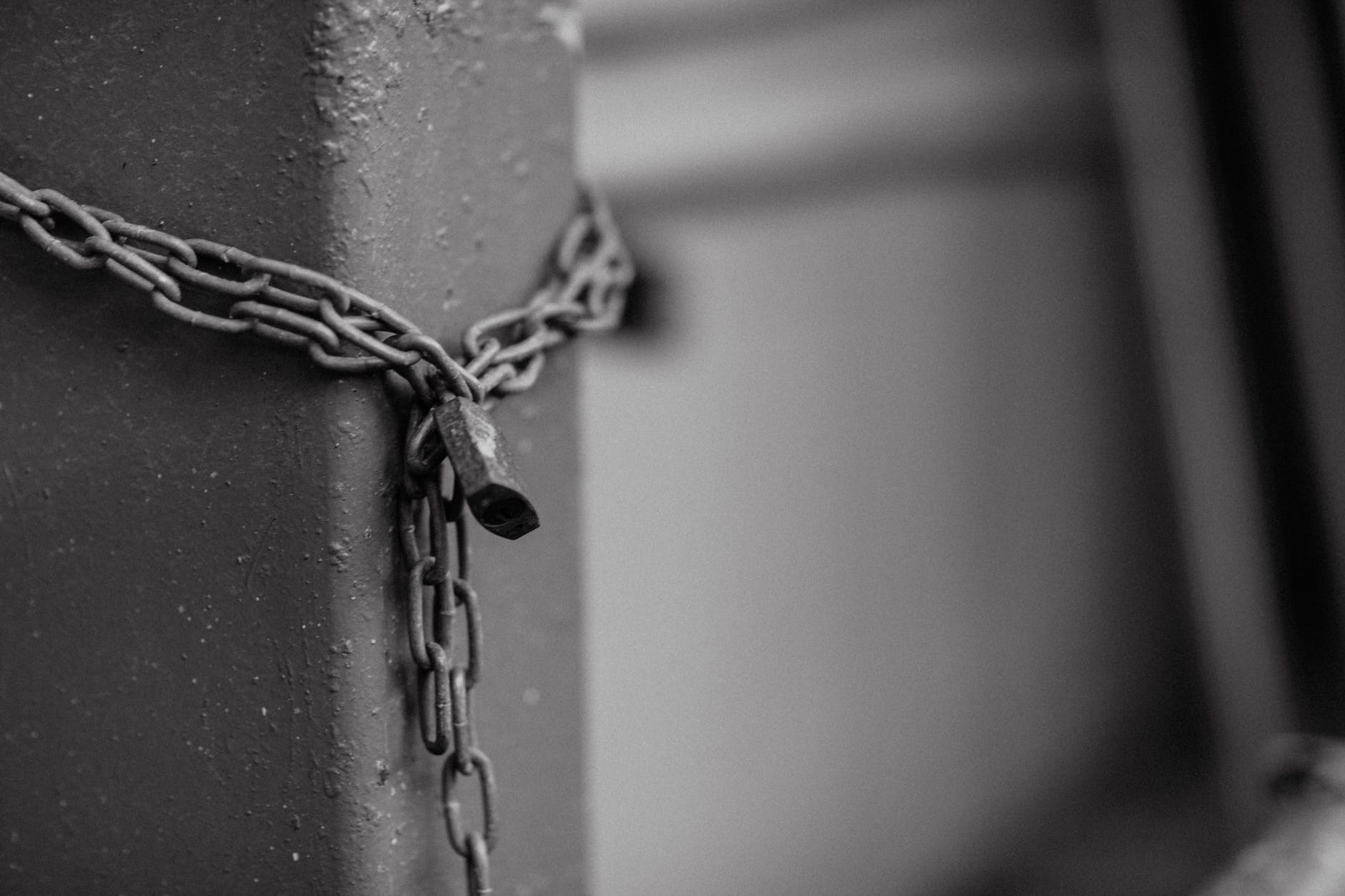 grayscale photo of steel chain with padlock – TCPAWorld
